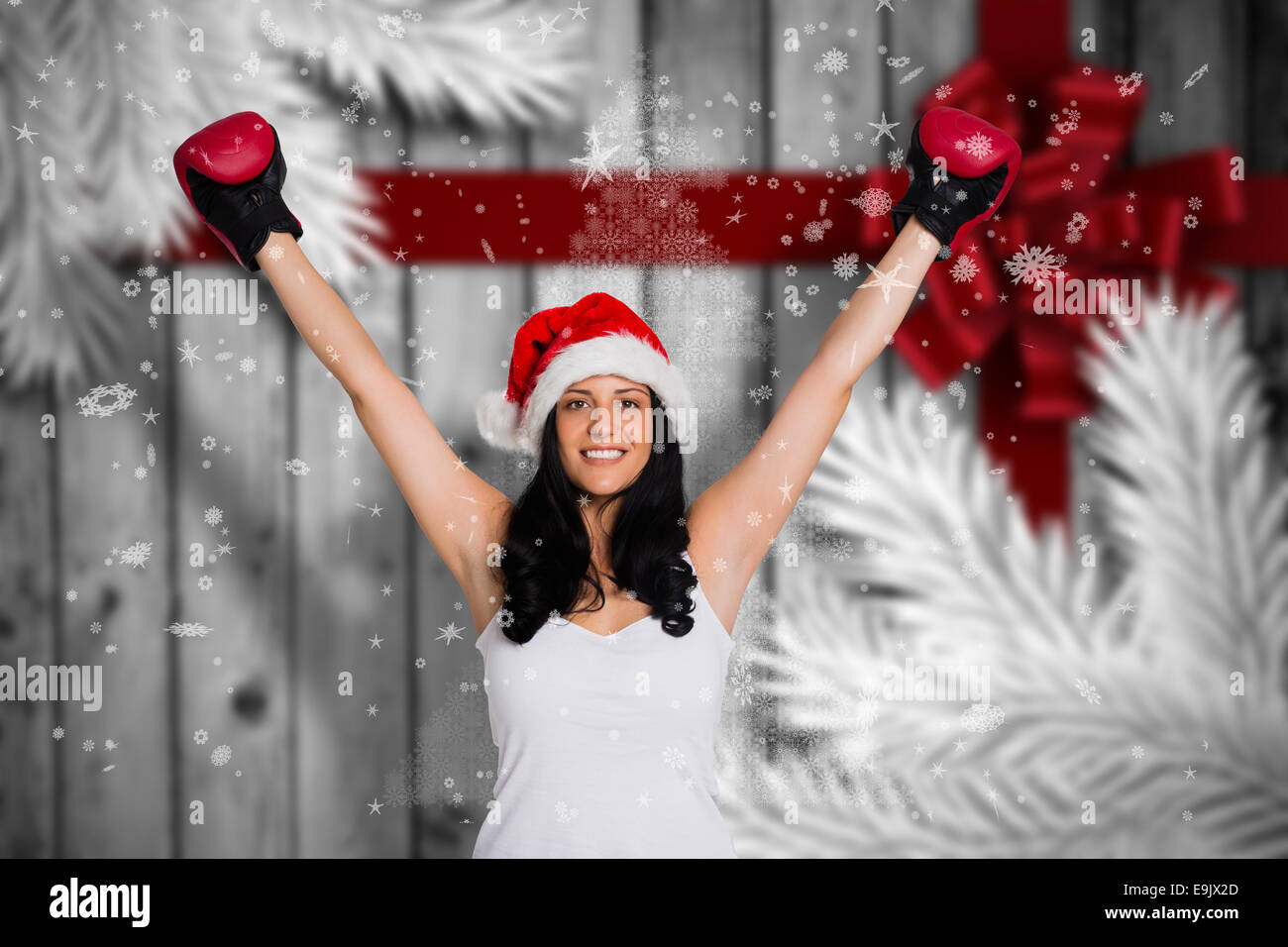 Composite image of woman wearing red boxing gloves Stock Photo - Alamy
