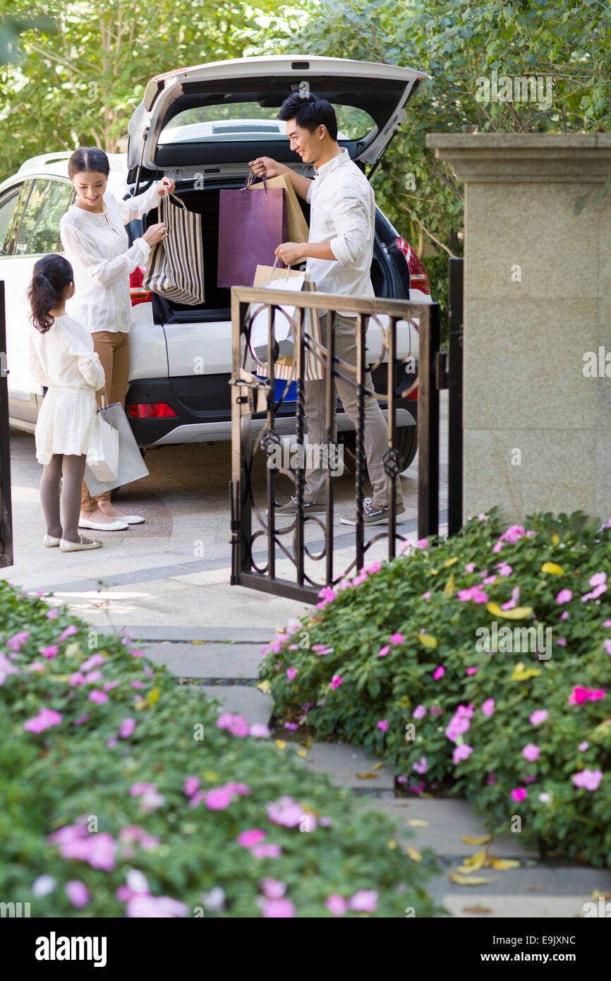 Young family coming back from shopping Stock Photo - Alamy