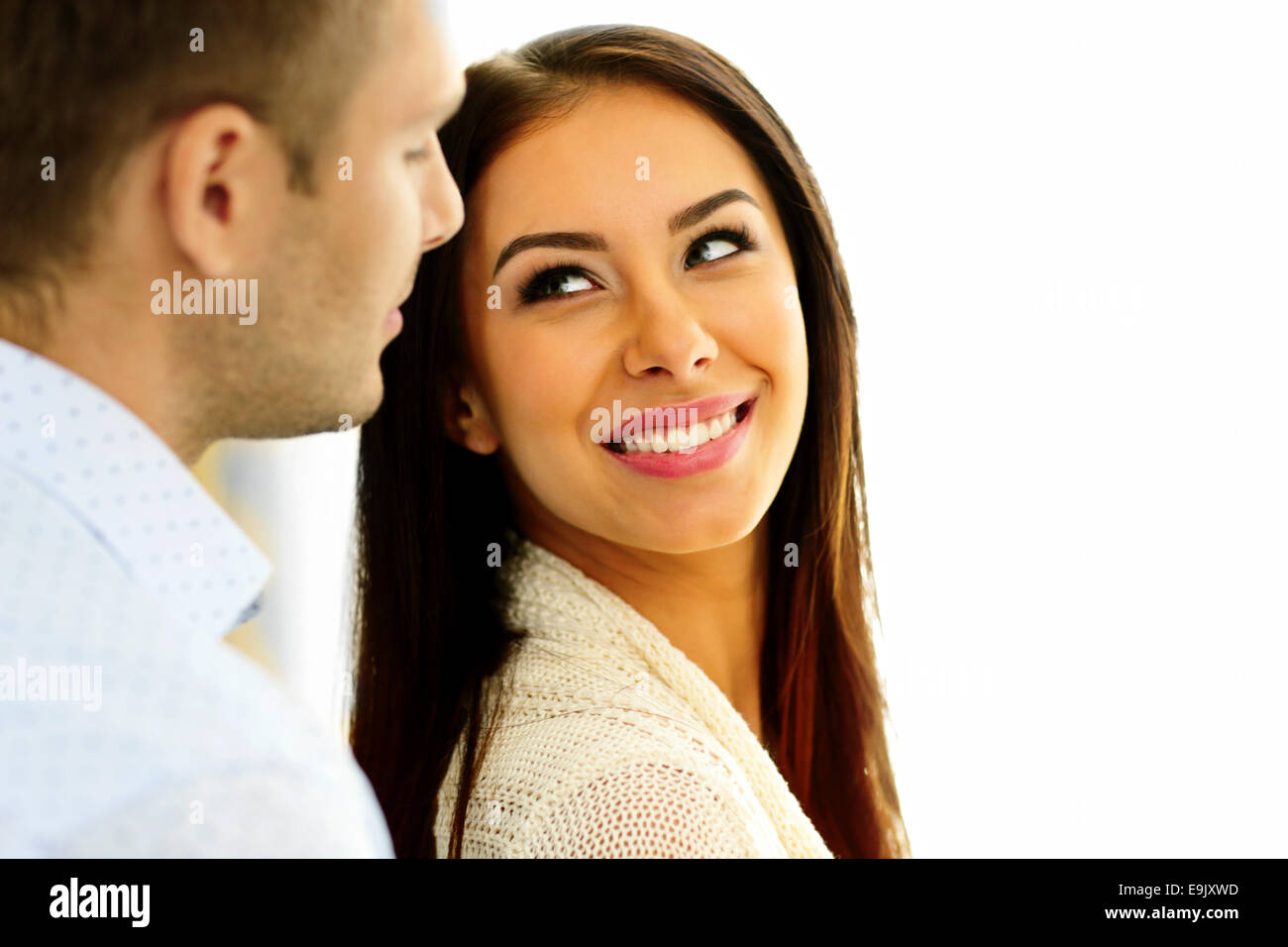 Smiling woman looking at man Stock Photo - Alamy