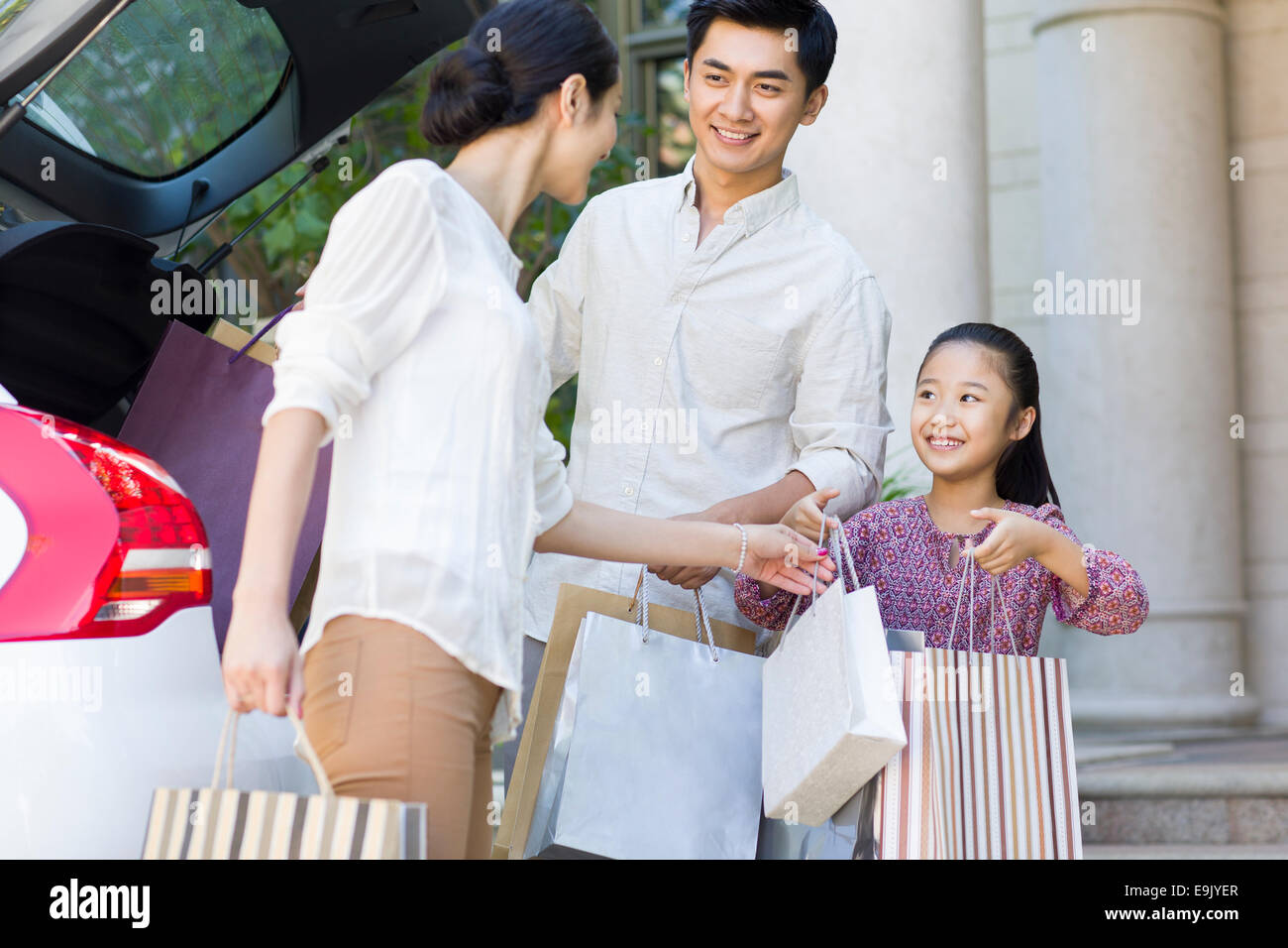 Young family coming back from shopping Stock Photo - Alamy