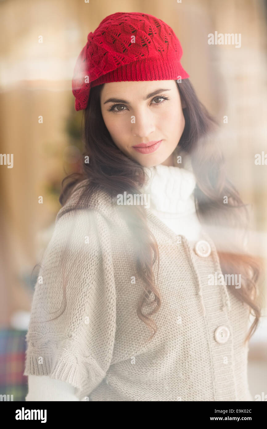 Portrait of a attractive brunette with red hat Stock Photo - Alamy