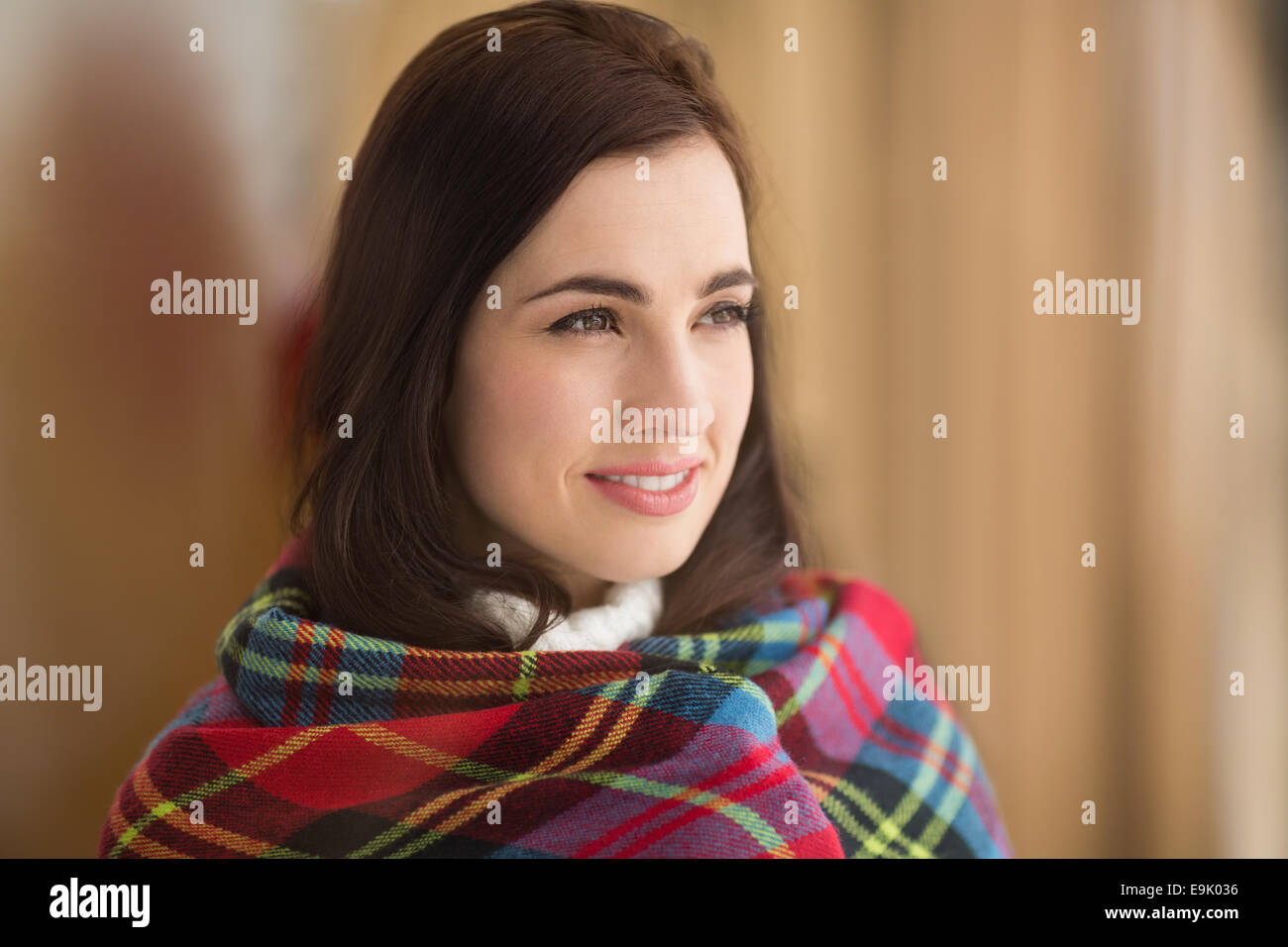 Portrait of a pretty brunette with cover Stock Photo - Alamy