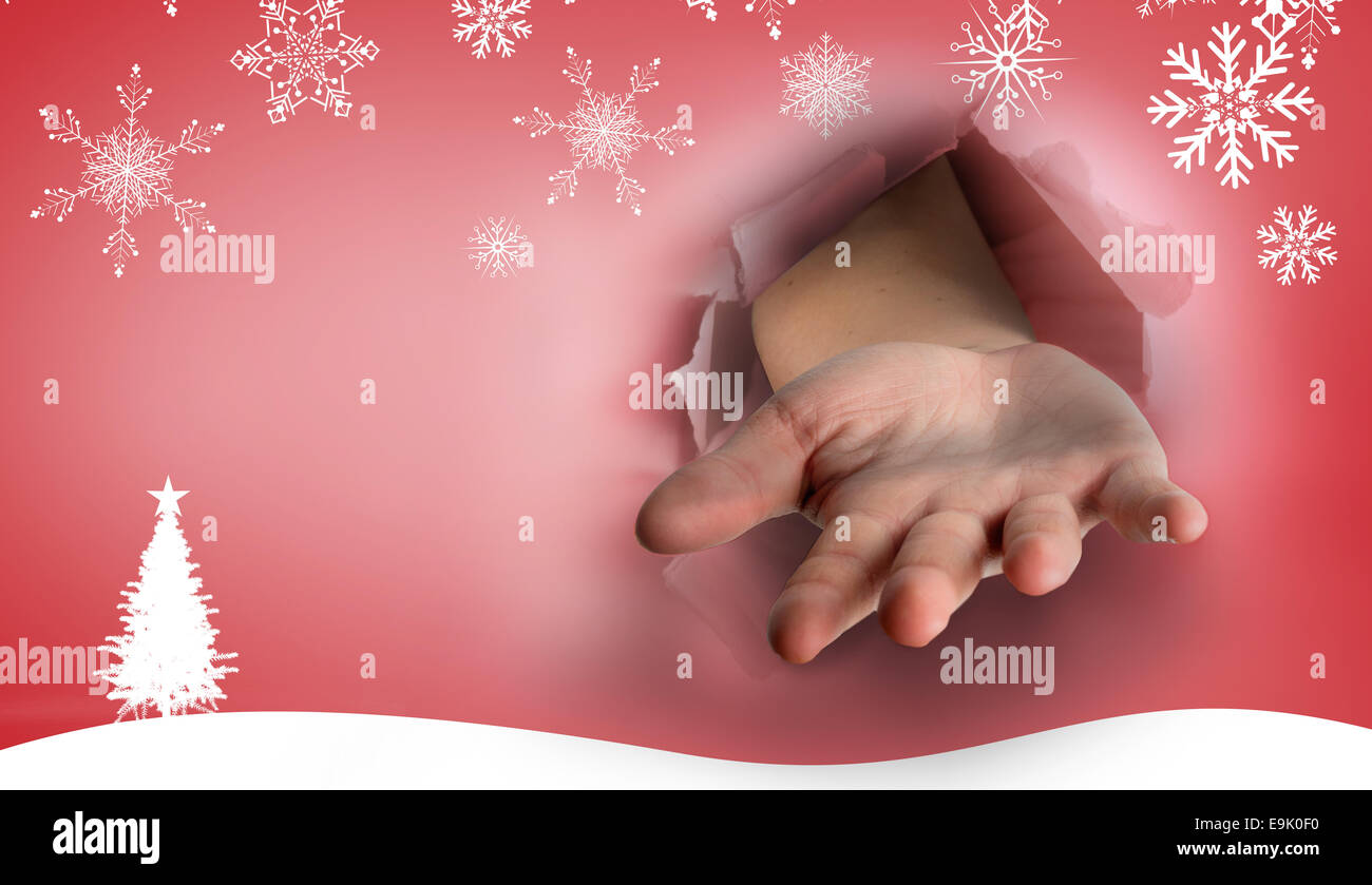 Composite image of hand bursting through paper Stock Photo - Alamy