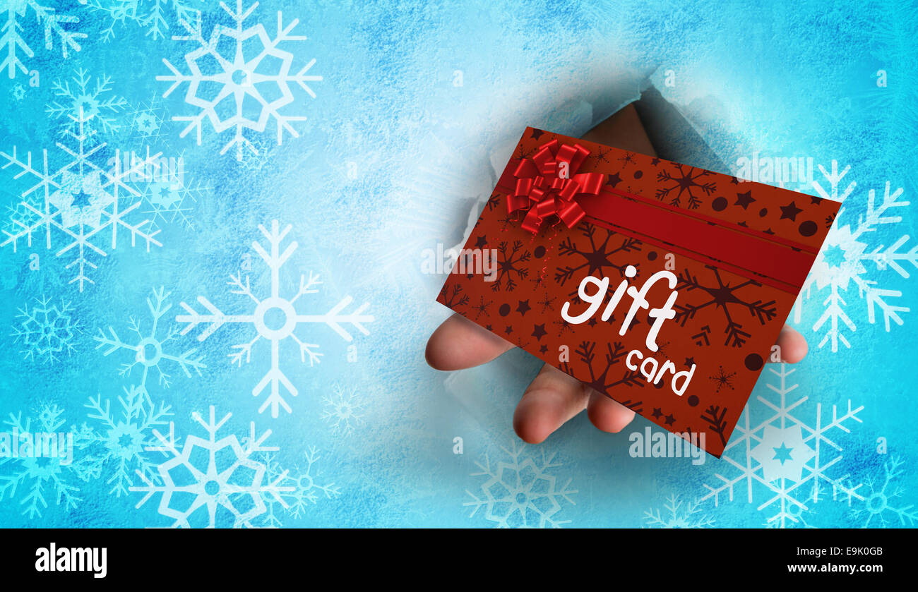 Composite image of hand bursting through paper Stock Photo - Alamy