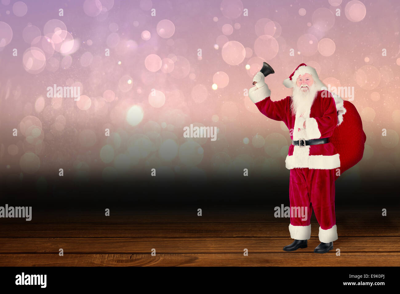 Santa claus ringing a bell Stock Photo - Alamy