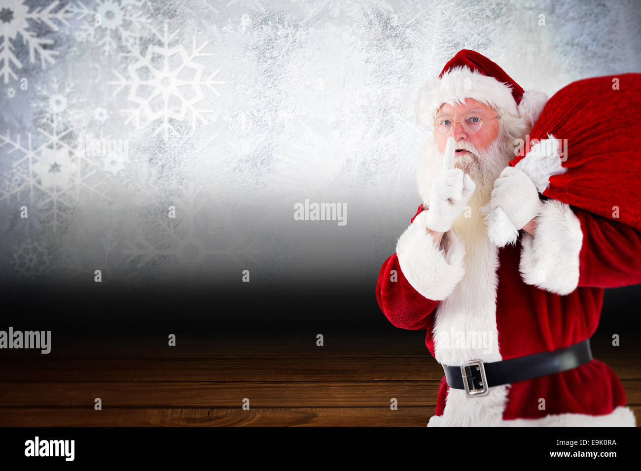 Santa claus being quiet Stock Photo - Alamy
