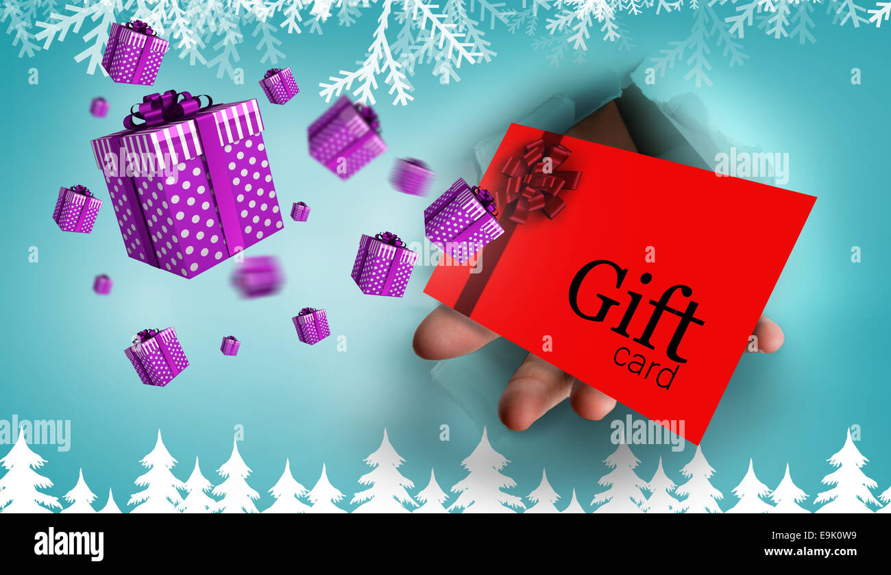 Composite image of hand bursting through paper Stock Photo - Alamy