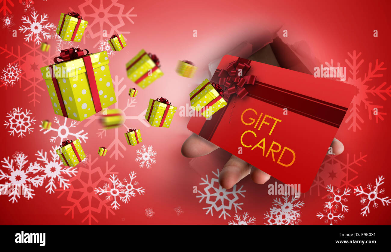 Composite image of hand bursting through paper Stock Photo - Alamy