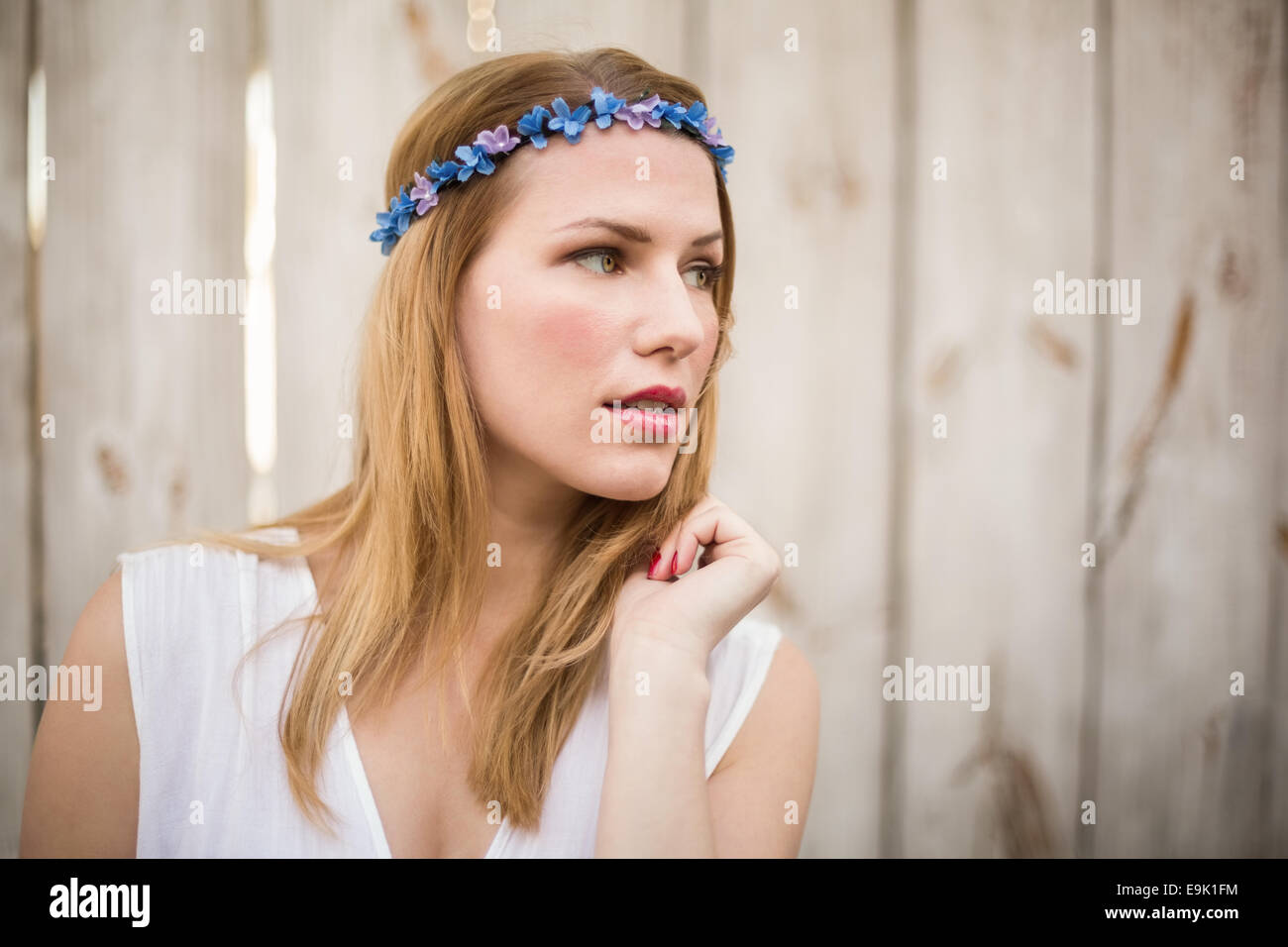 Blonde woman wearing headband looking away Stock Photo - Alamy