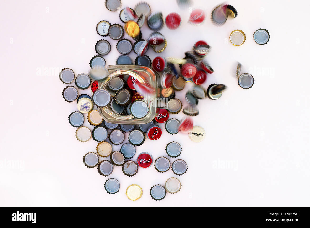 Bottle tops falling Stock Photo - Alamy