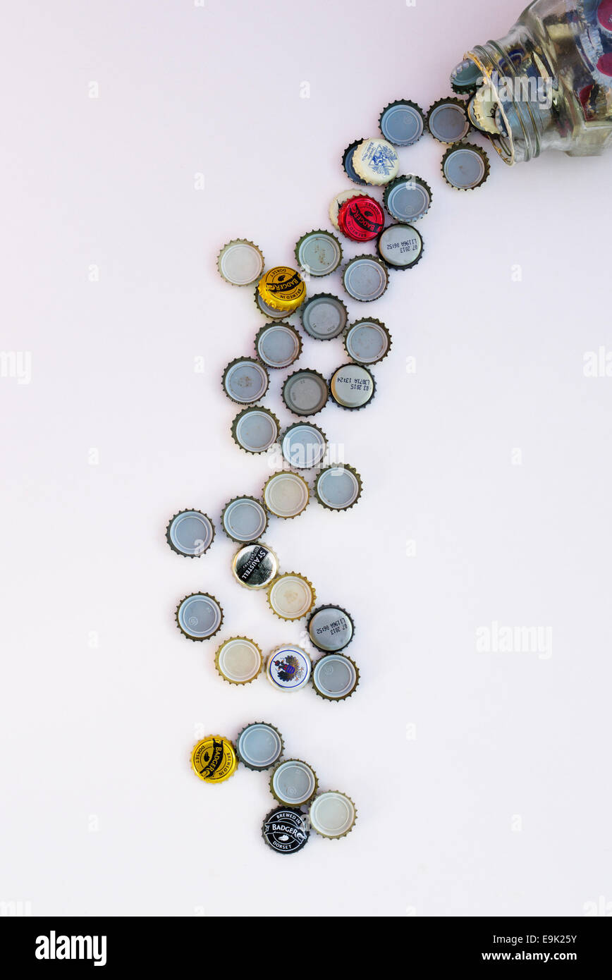 Bottle tops falling Stock Photo - Alamy