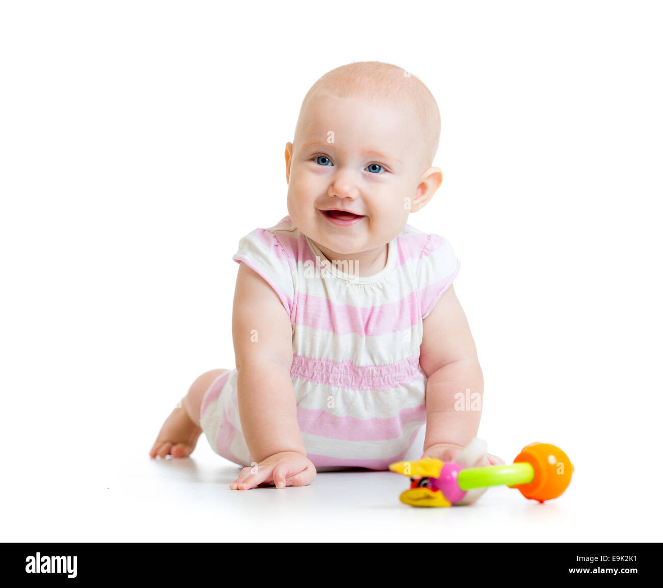 laying baby girl using teether Stock Photo - Alamy