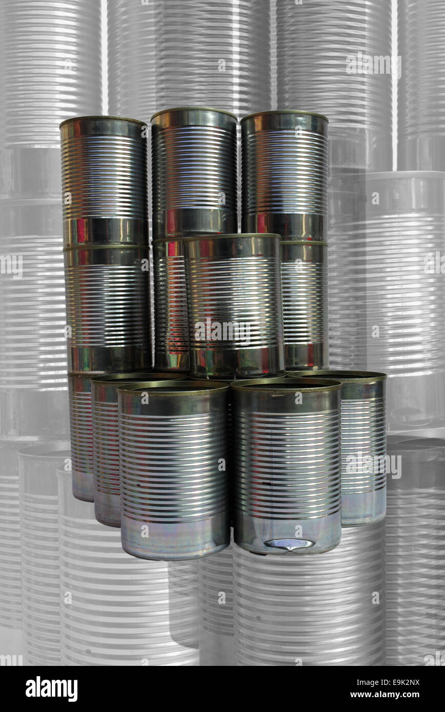 A stack of tin cans on a can background Stock Photo - Alamy