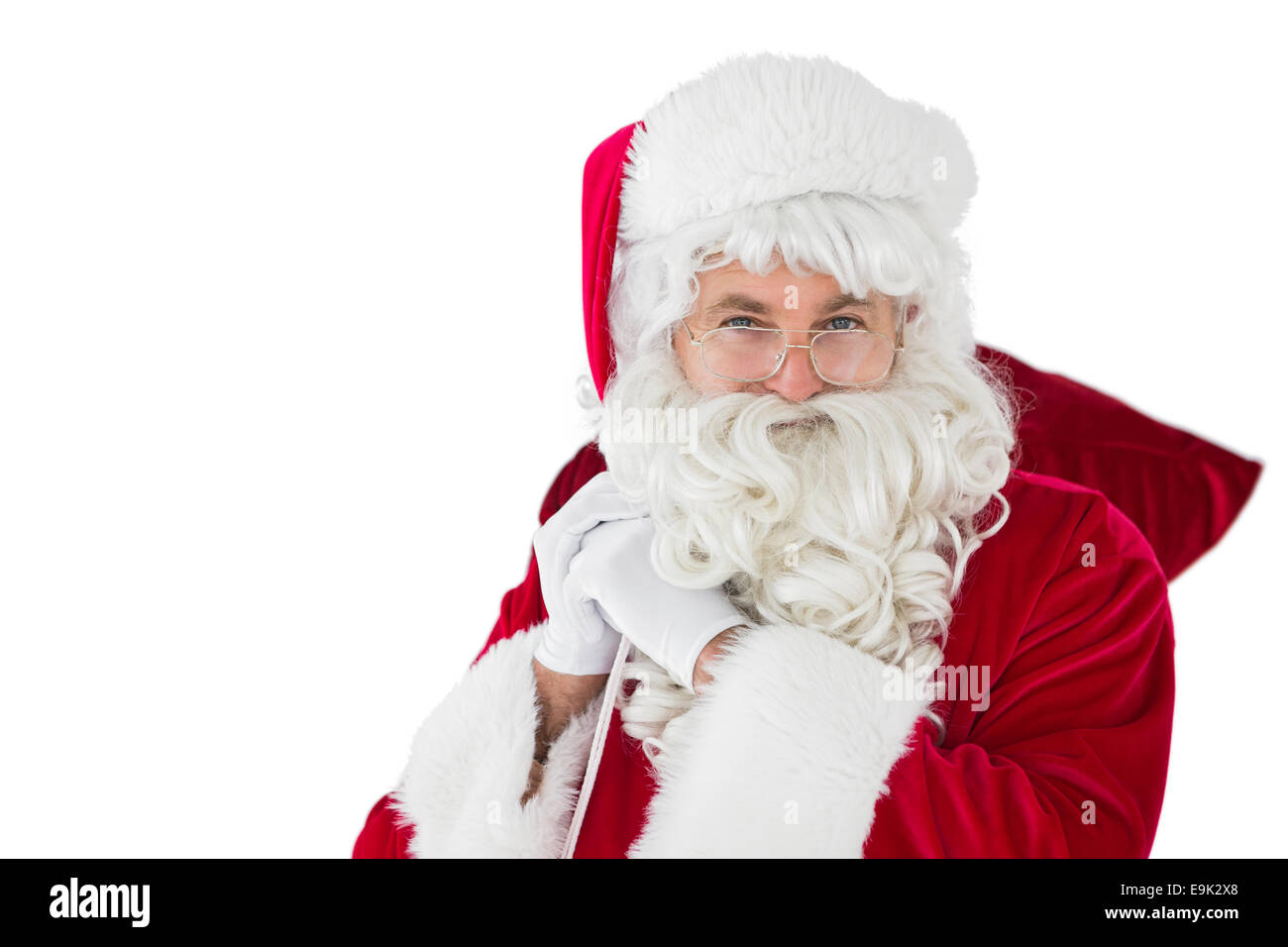 Happy santa claus holding his sack Stock Photo - Alamy