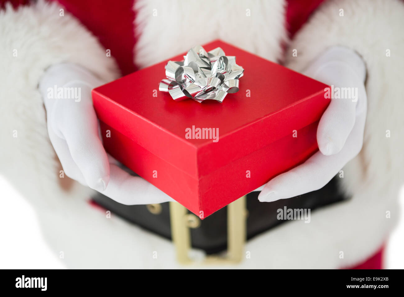 Father christmas holding gift hi-res stock photography and images - Alamy