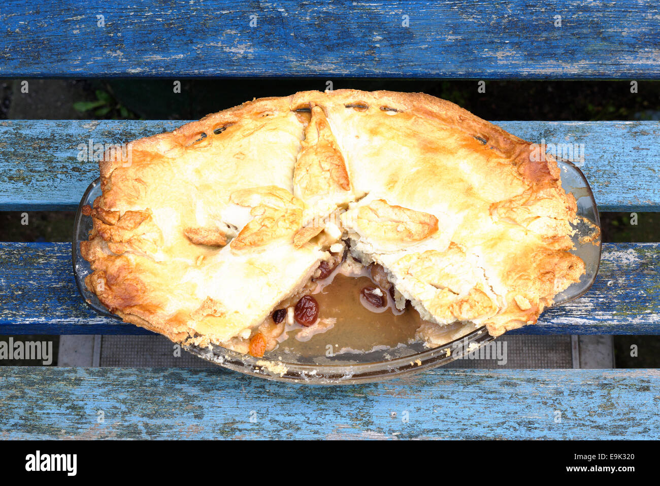 A home cooked apple and rain pie to good to leave whole Stock Photo - Alamy