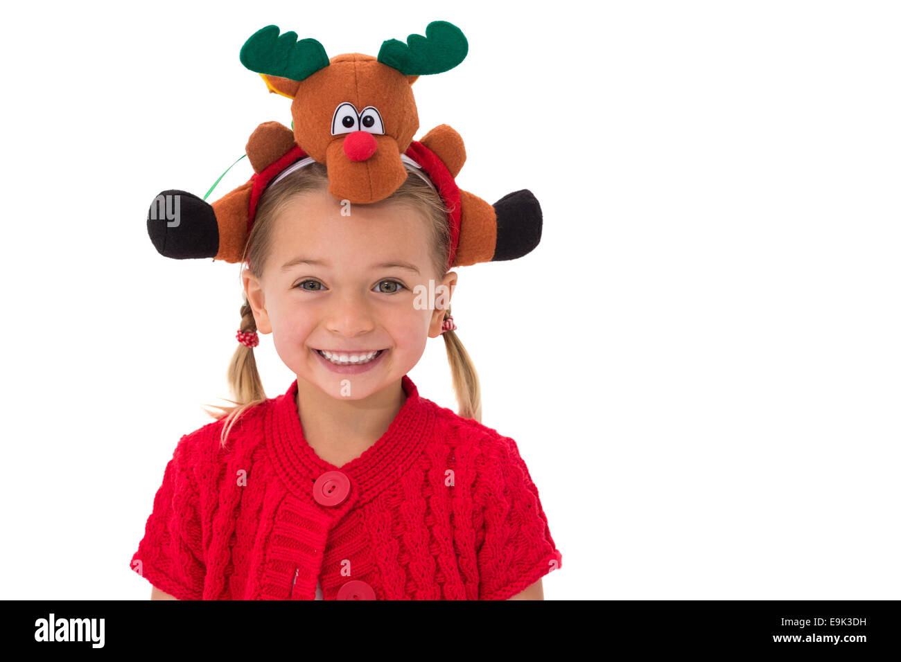 Cute little girl wearing rudolph headband Stock Photo - Alamy