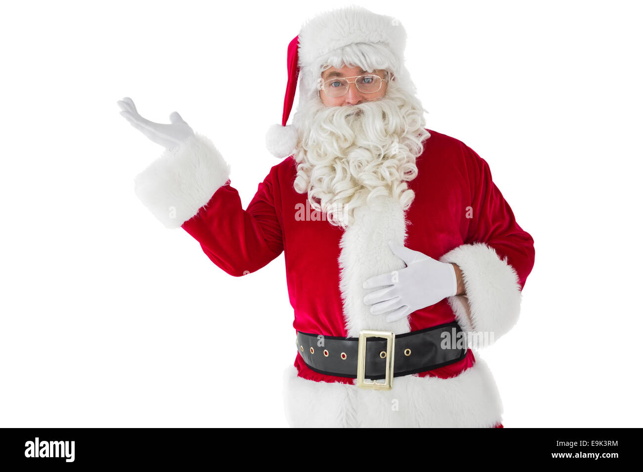 Happy santa with his hand out Stock Photo - Alamy