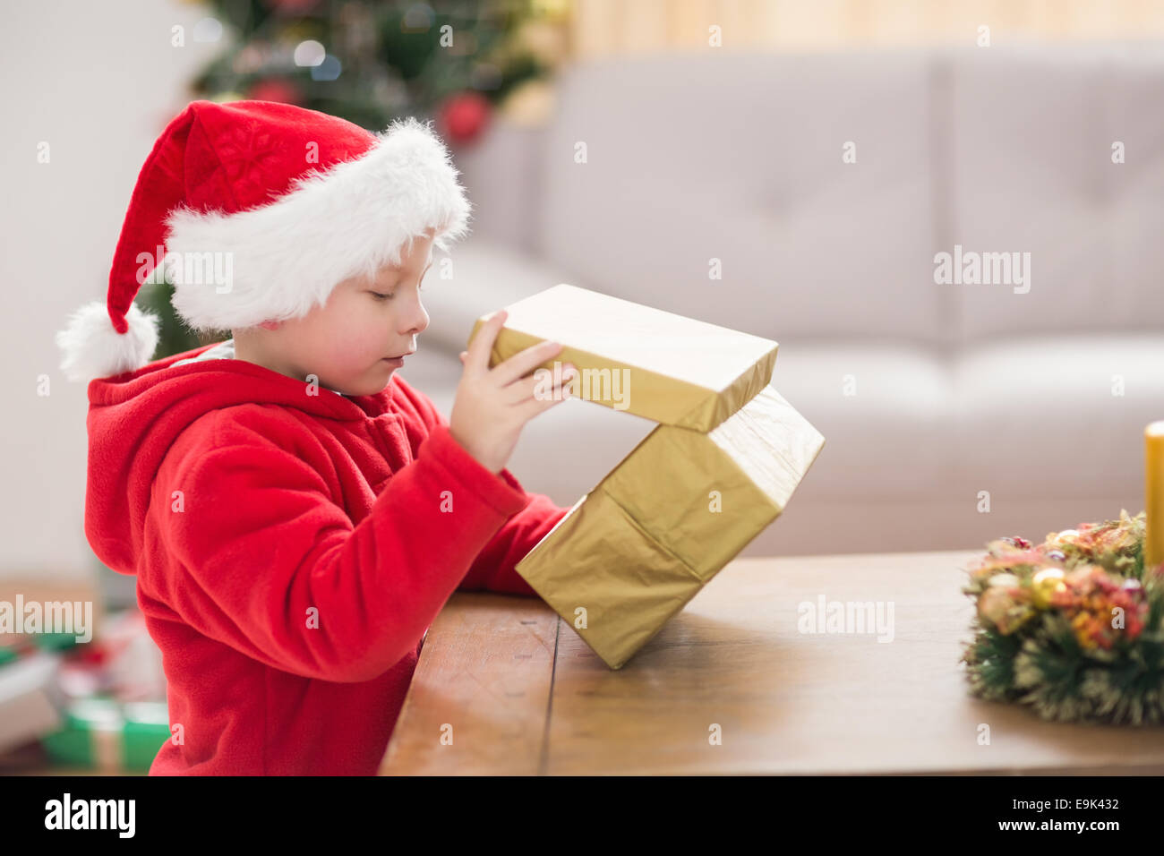 Boy opening present hi-res stock photography and images - Alamy