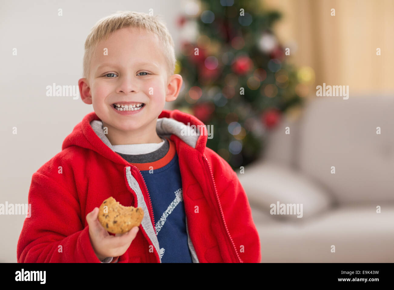 Festive little boy smiling at camera Stock Photo - Alamy