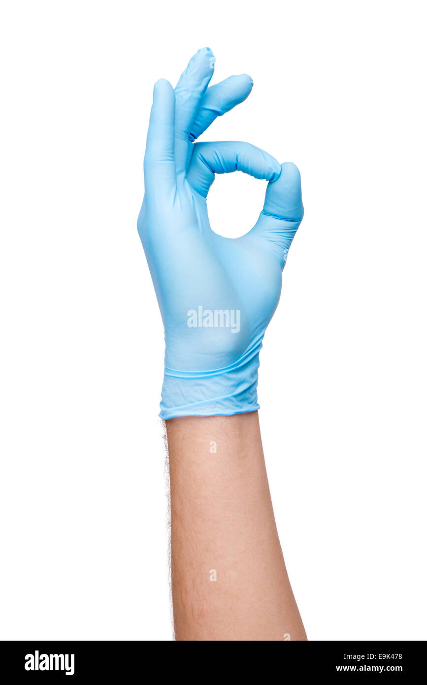 Hand in blue glove showing OK sign Stock Photo - Alamy