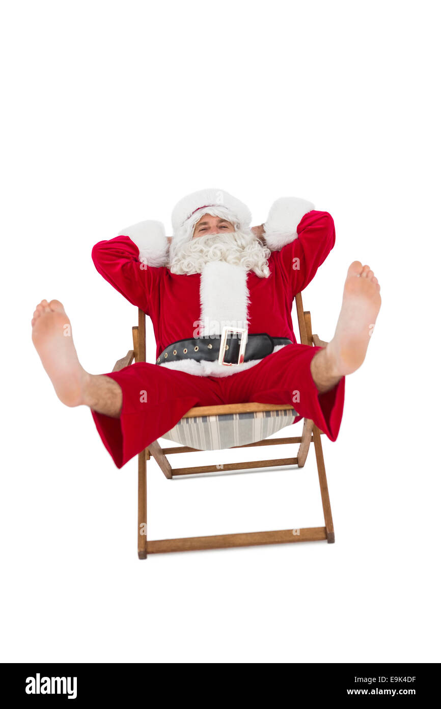 Relaxed santa stiting on deckchair Stock Photo - Alamy