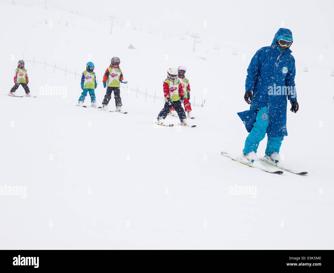 young children aged five years wearing helmets and goggles learning to ...