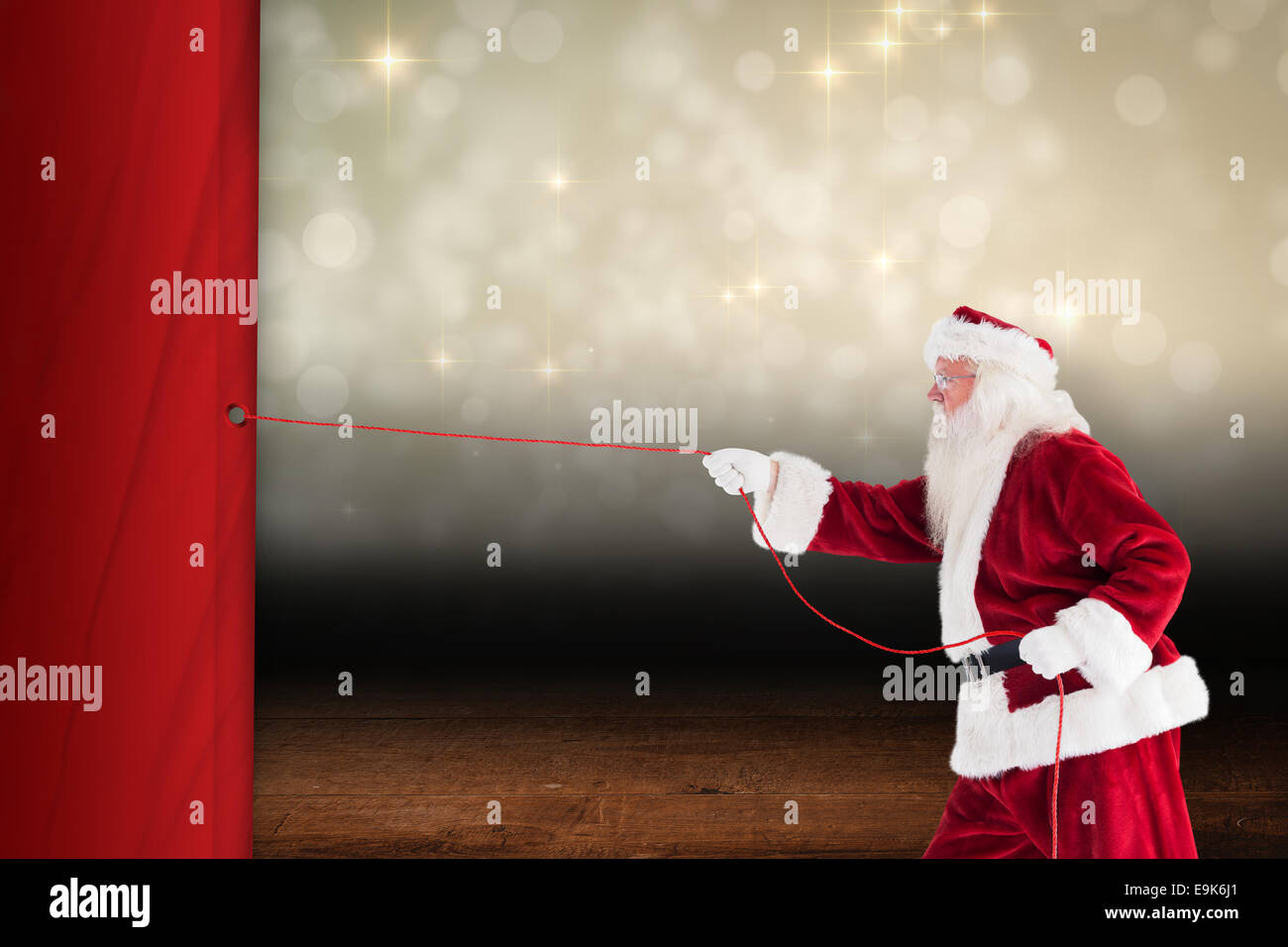 Santa claus pulling a rope Stock Photo - Alamy