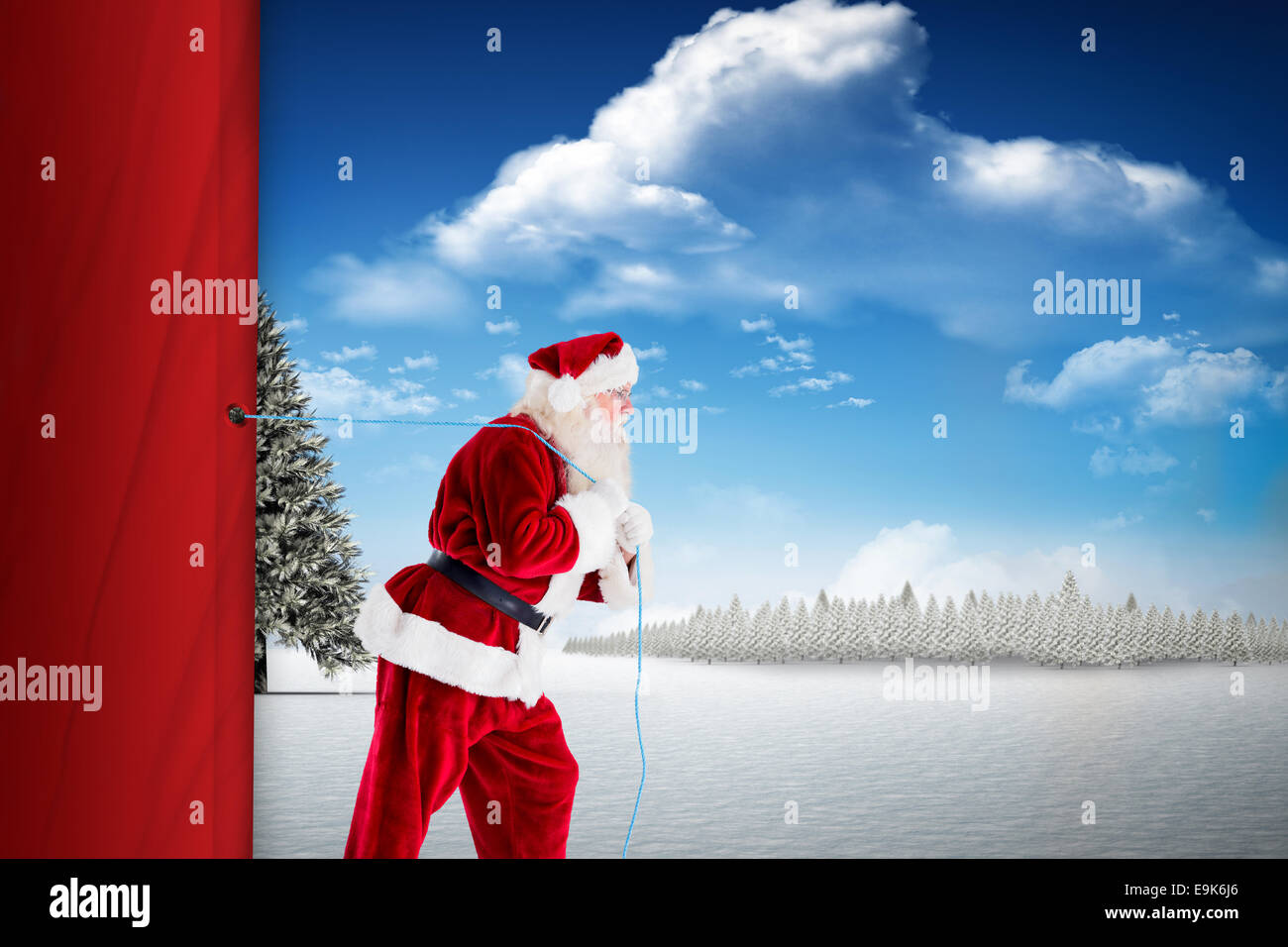 Santa claus pulling a rope Stock Photo - Alamy