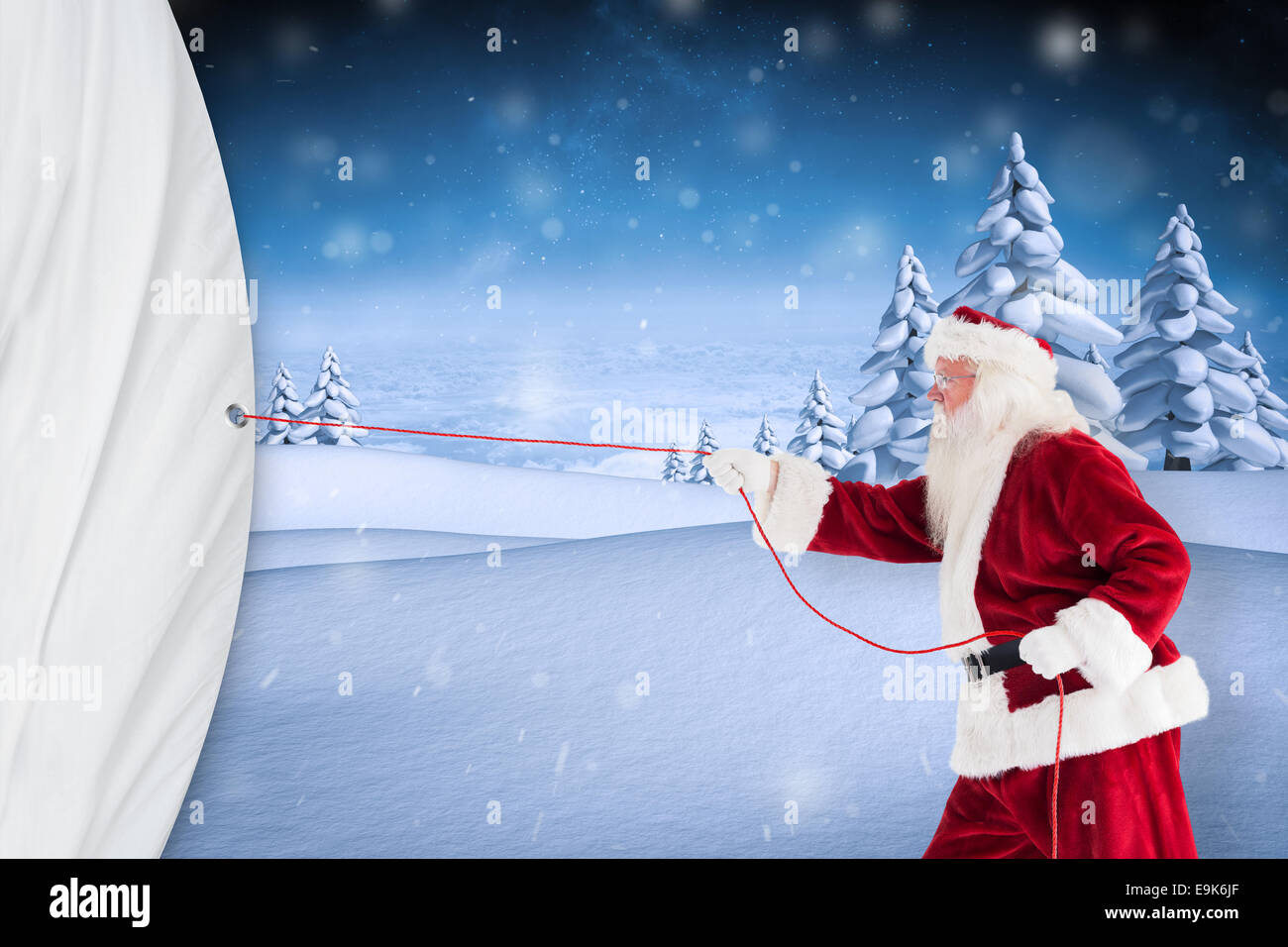 Santa claus pulling a rope Stock Photo - Alamy