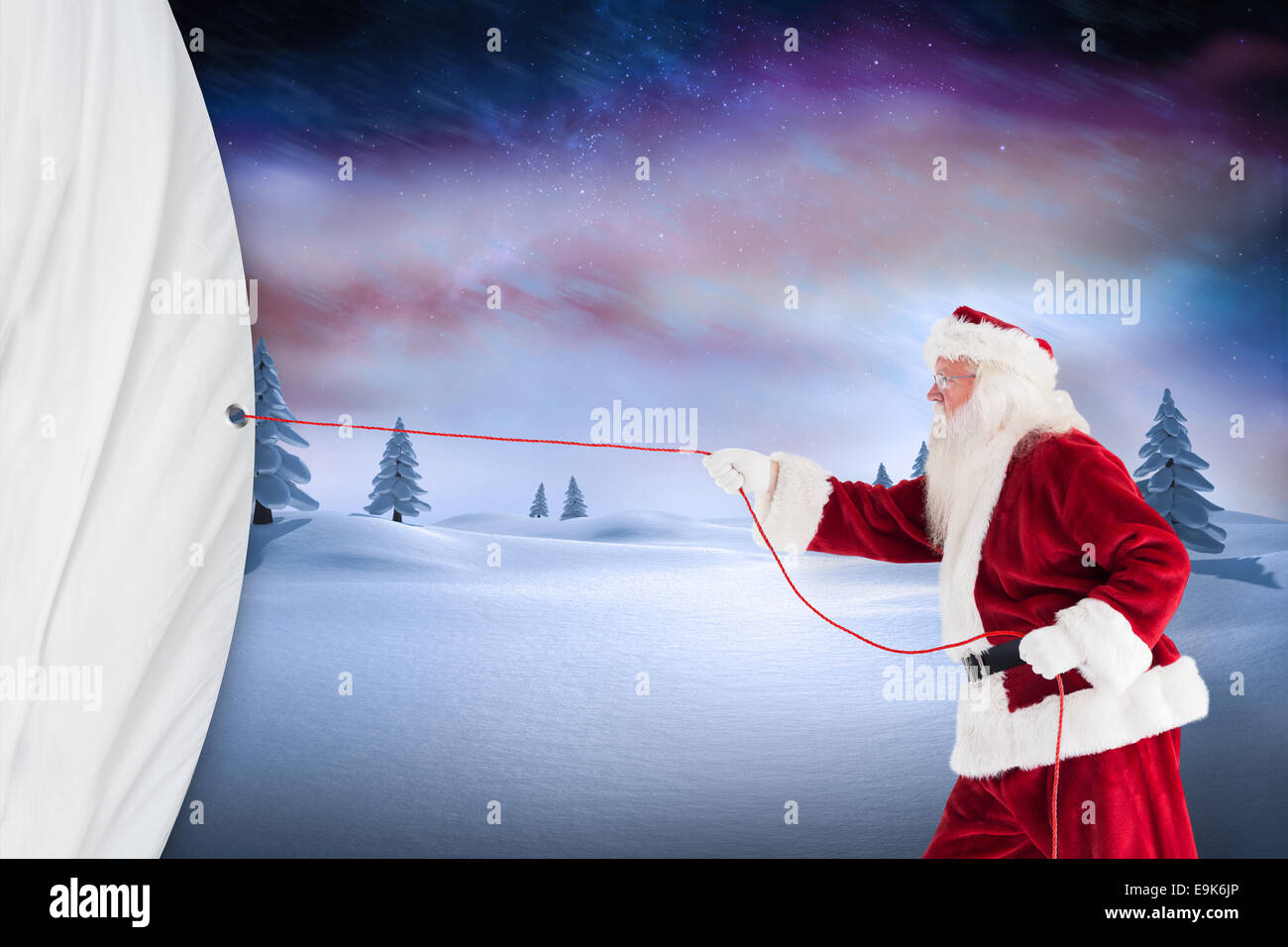Santa claus pulling a rope Stock Photo - Alamy