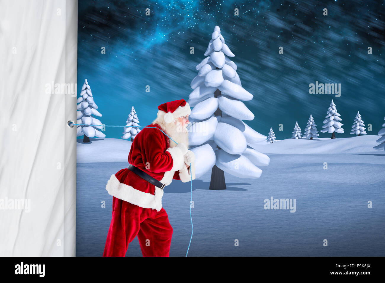 Composite image of santa claus pulling rope Stock Photo - Alamy