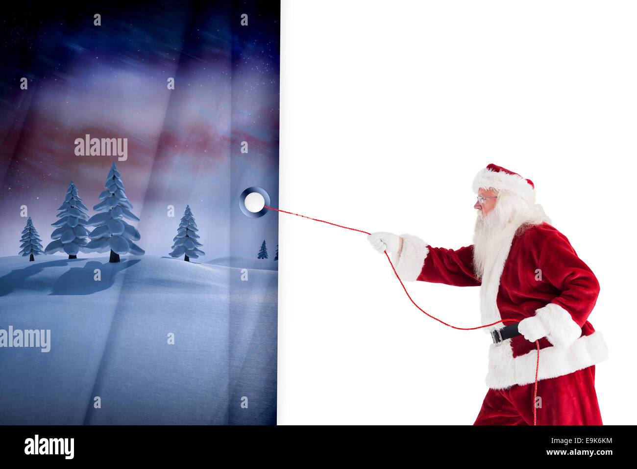 Santa claus pulling a rope Stock Photo - Alamy