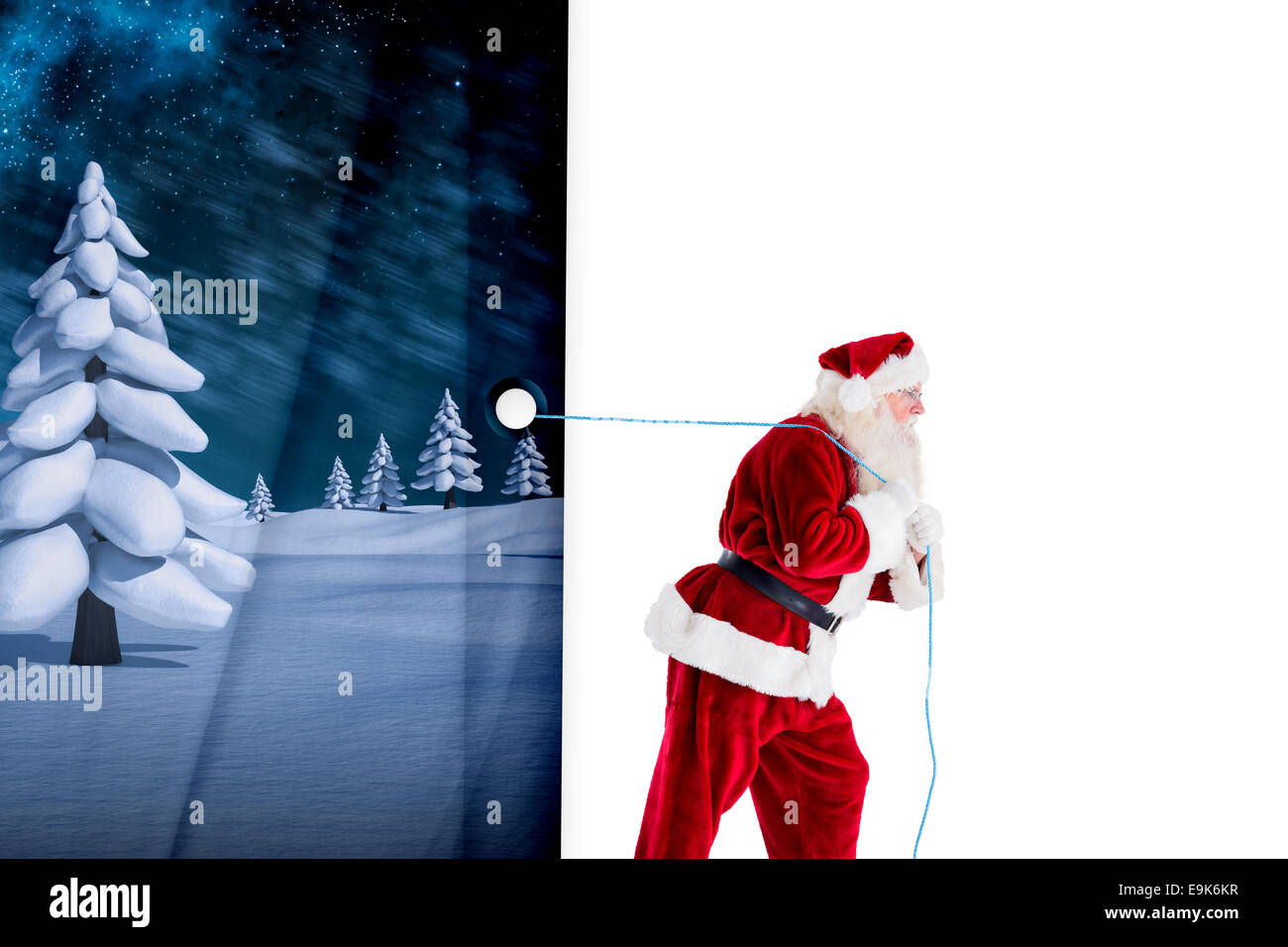 Santa claus pulling a rope Stock Photo - Alamy