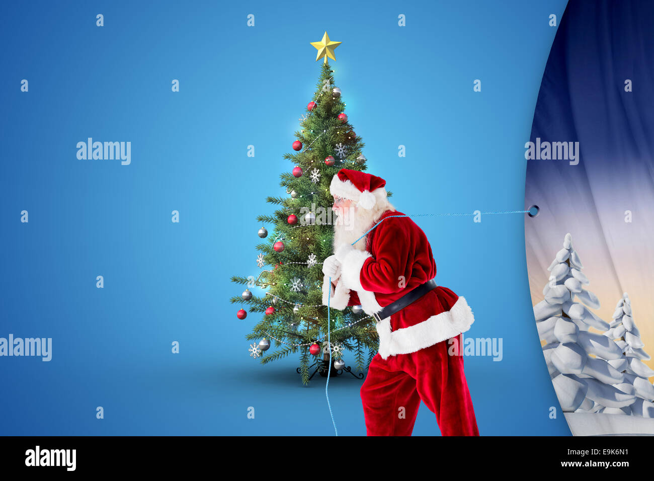 Composite image of santa claus pulling rope Stock Photo - Alamy