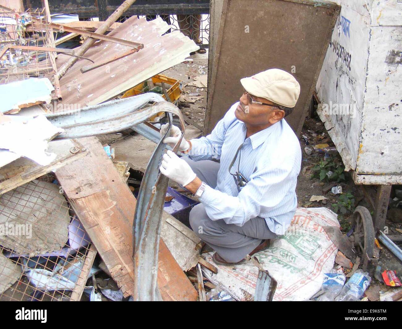 Forensic man investigating materials after unidentified blast at ...