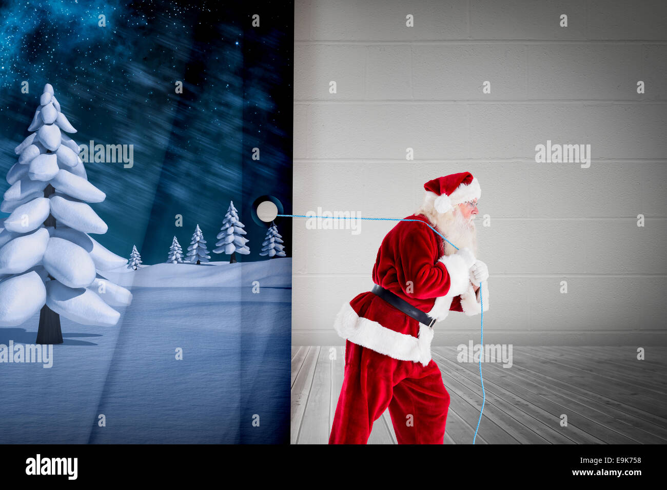 Composite image of santa claus pulling rope Stock Photo - Alamy