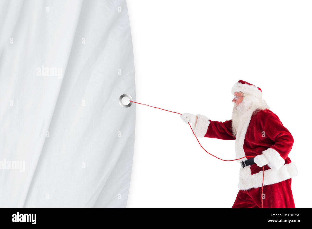Santa claus pulling a rope Stock Photo - Alamy