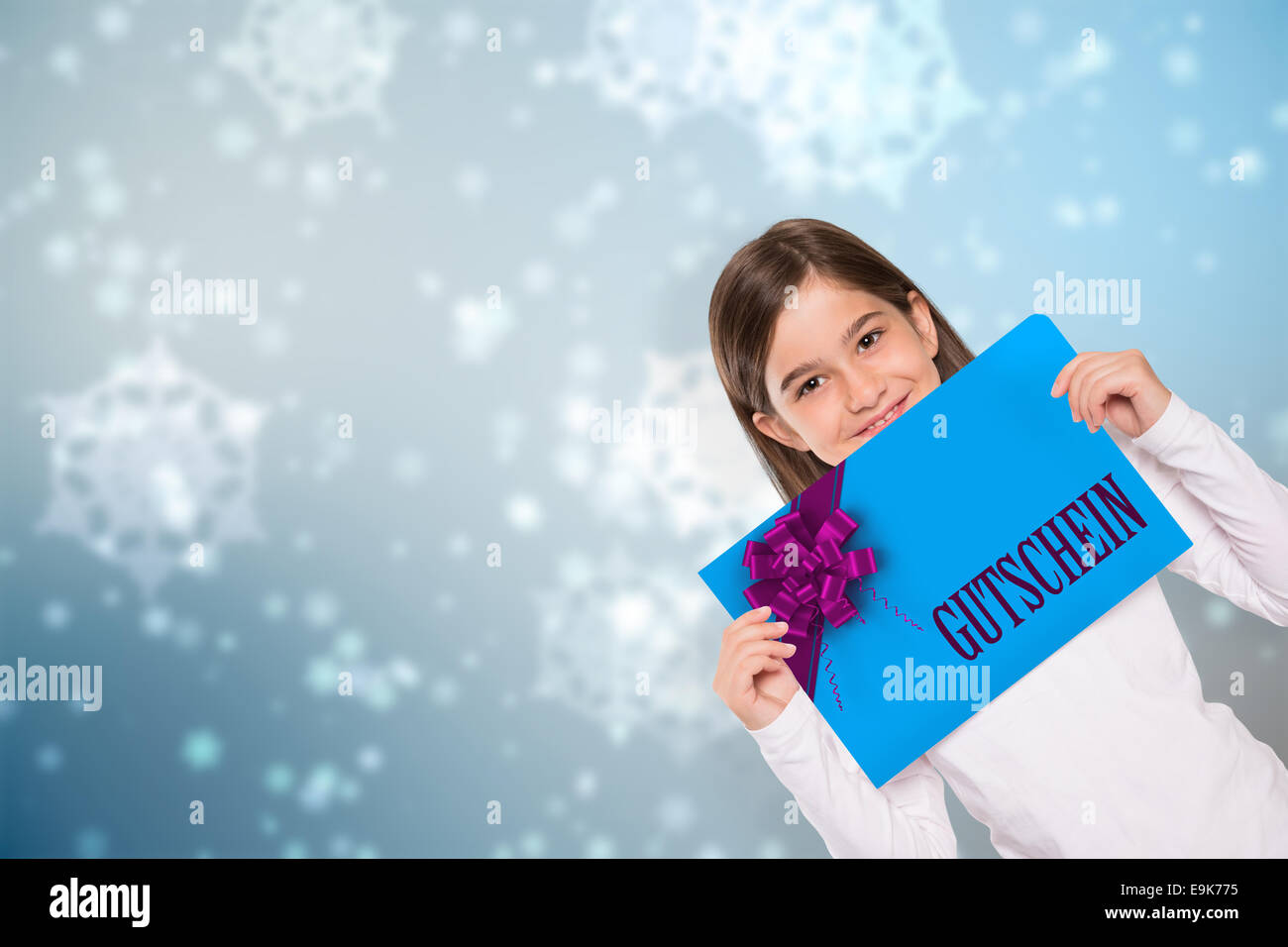 Composite image of cute little girl showing card Stock Photo - Alamy