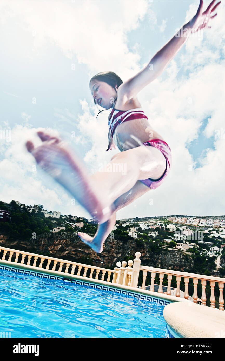 Child Jumping into Pool Stock Photo - Alamy