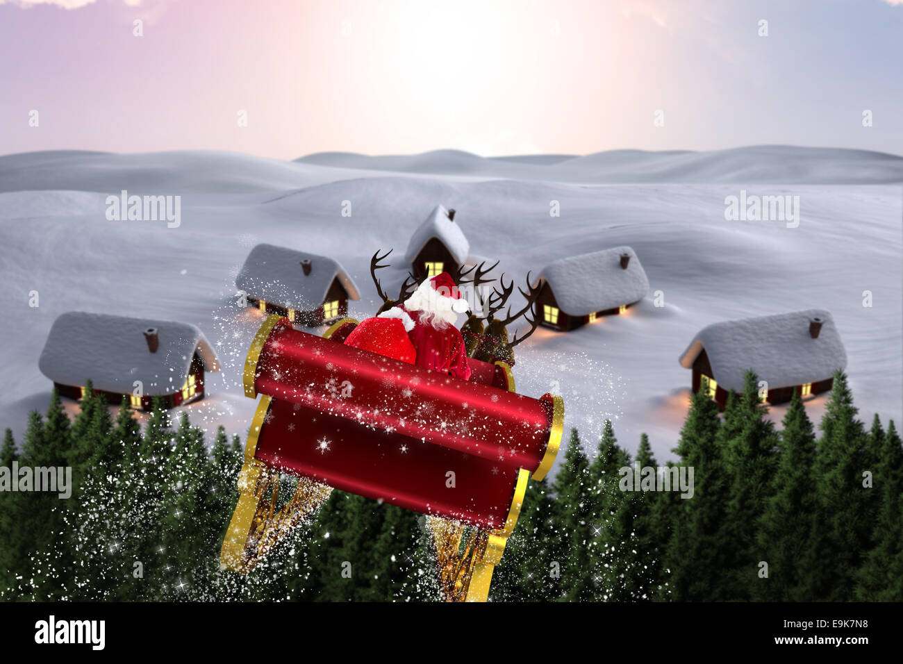 Composite image of santa flying his sleigh Stock Photo - Alamy