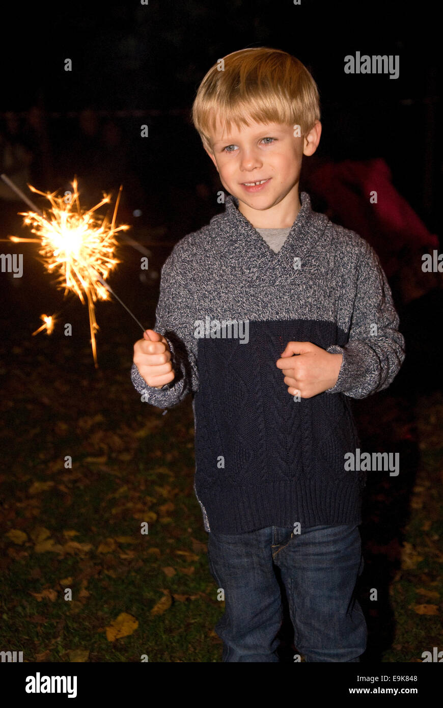 Young boy playing with sparkler at the end of Liphook Carnival, 25 ...