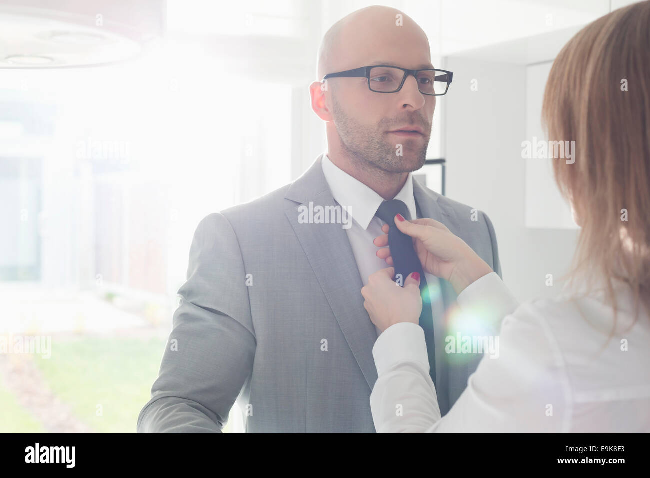 Two men adjusting hi-res stock photography and images - Alamy