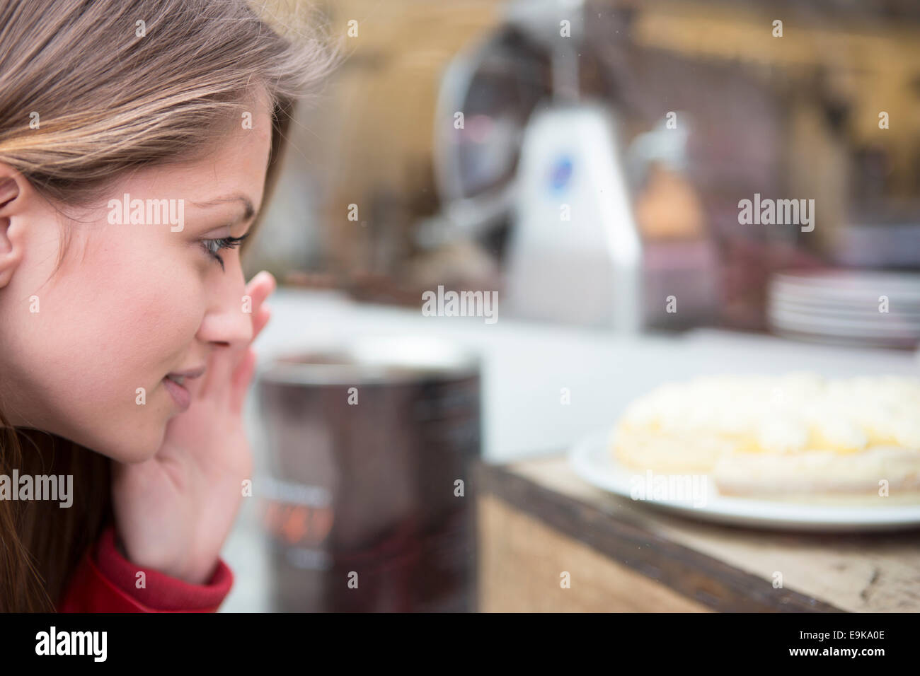 Woman cake temptation hi-res stock photography and images - Alamy