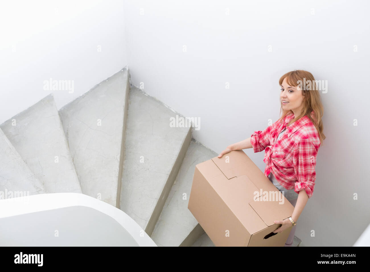 Person carrying box walking hi-res stock photography and images - Alamy