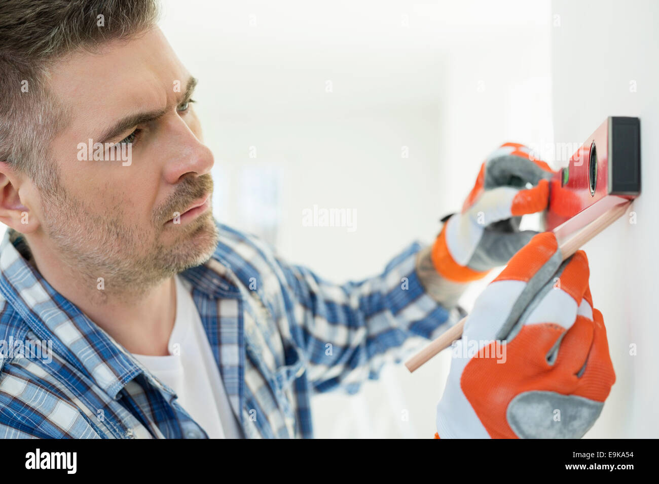 Person measuring marking on wall hi-res stock photography and images ...
