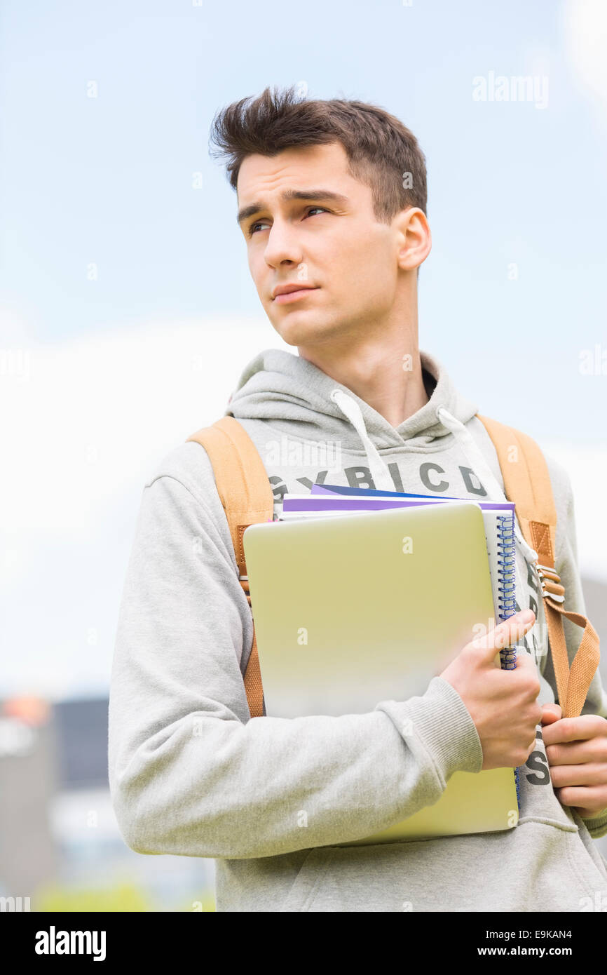 College student male holding books hi-res stock photography and images ...