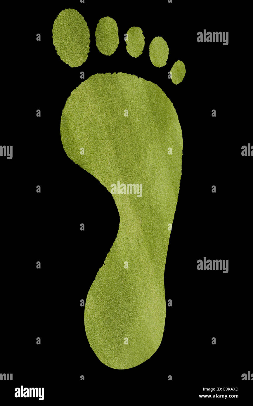 Close-up of green footprint over black background Stock Photo - Alamy