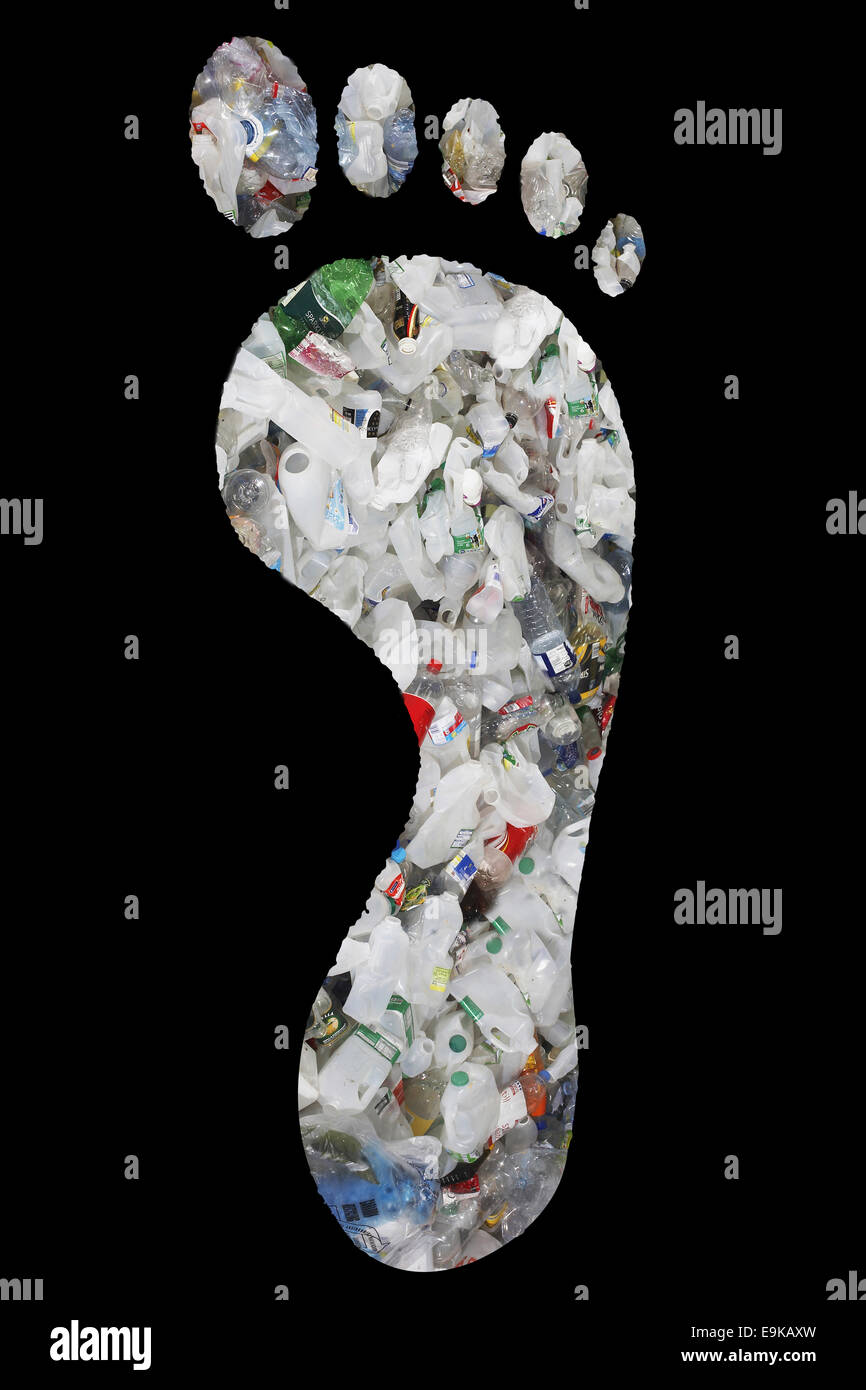 Pile of plastic bottles in footprints over black background Stock Photo ...