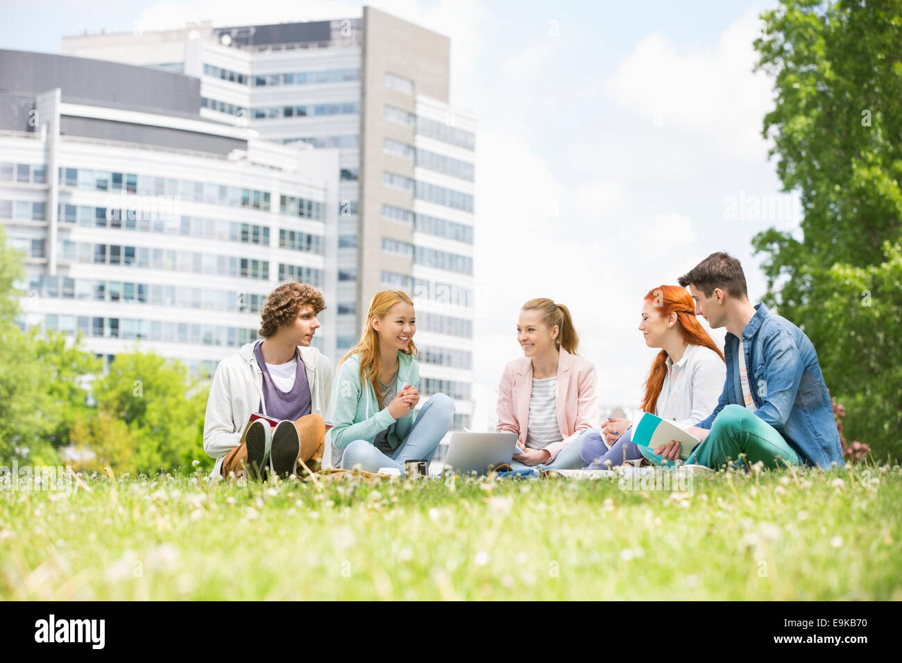 University students studying together on campus ground Stock Photo - Alamy